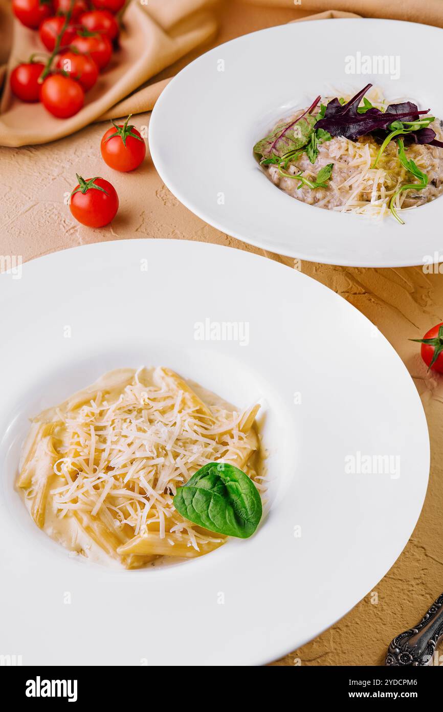 Penne pasta with parmesan and rice with parmesan Stock Photo - Alamy