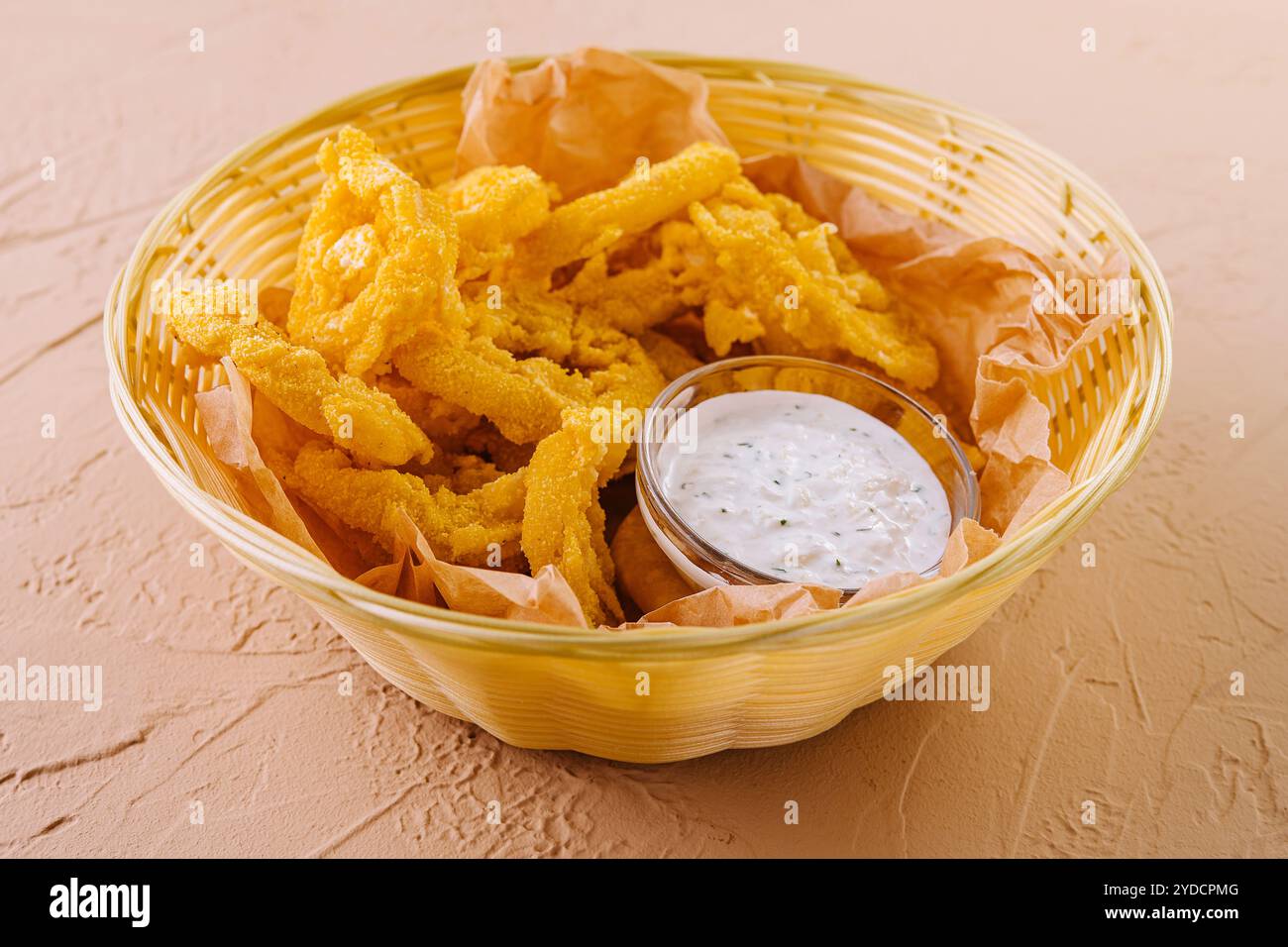 Fried onion rings in white basket Stock Photo - Alamy