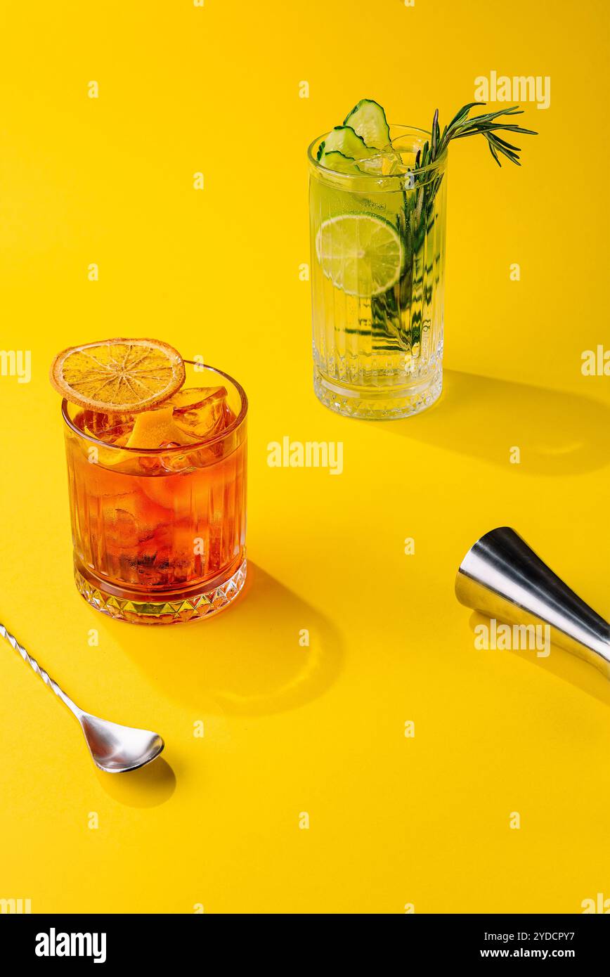 Cocktail Negroni and mojito cocktail on yellow background Stock Photo ...