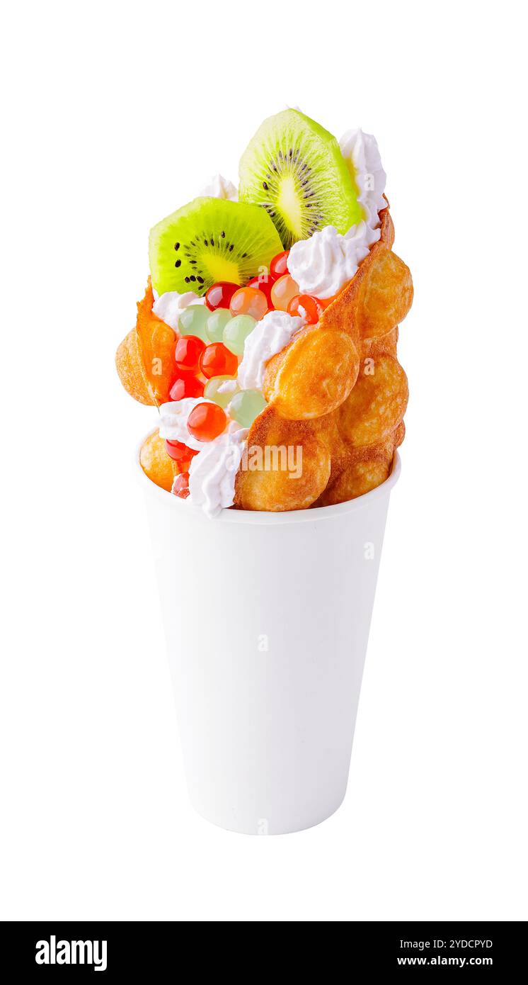 Bubble Waffle with kiwi, bubble tea and whipped cream Stock Photo - Alamy