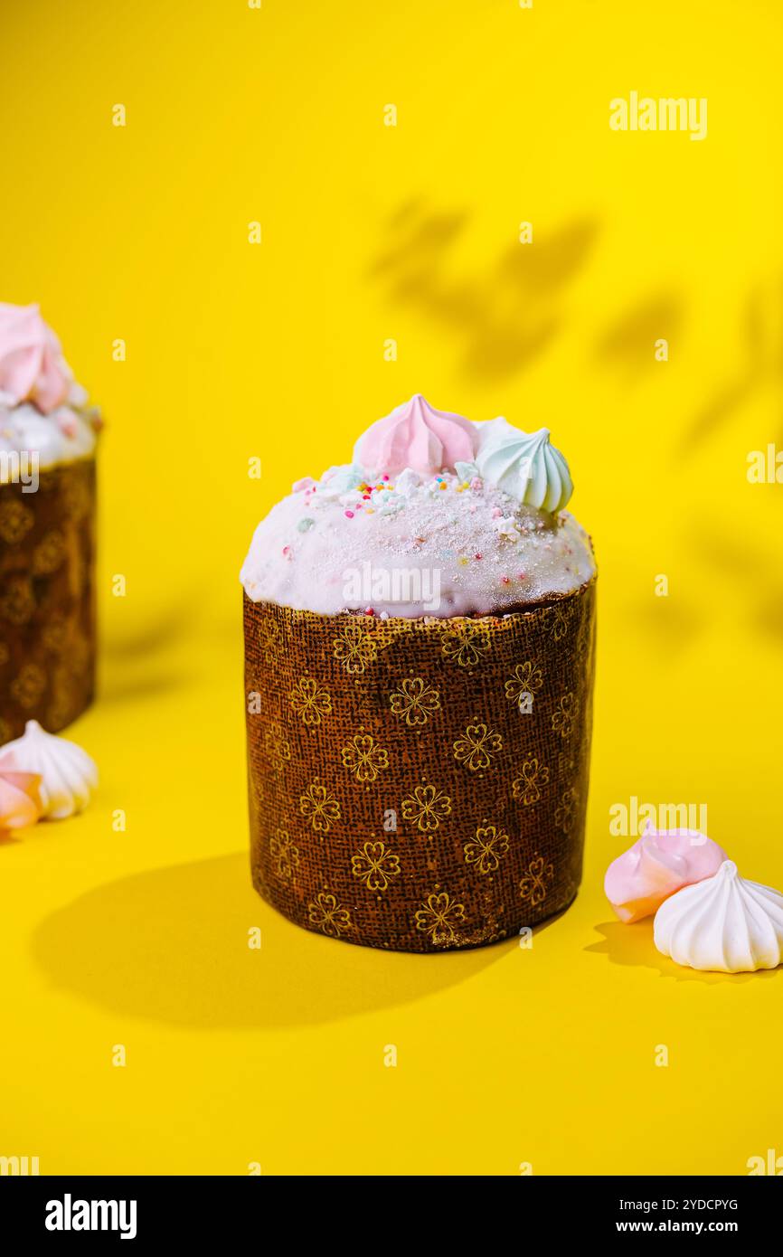 Traditional Easter cakes with meringue on yellow background Stock Photo ...