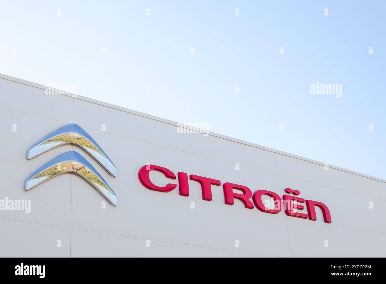 Citroen brand logo on clear blue sky background Stock Photo - Alamy