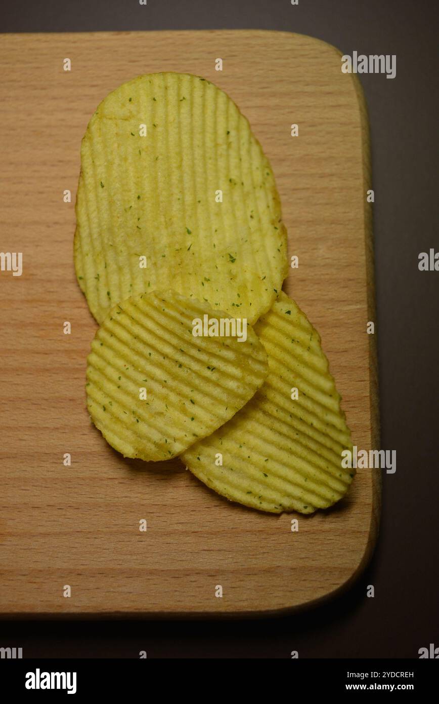 Fast food, not healthy food for human health. Thin slices of potatoes ...