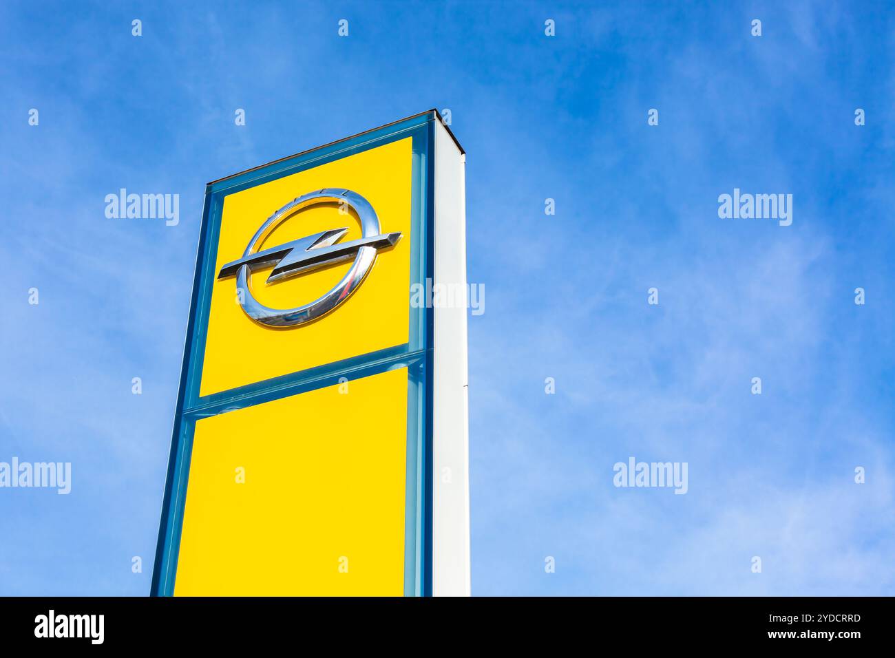 Opel brand logo on bright blue sky background located in Lyon, France ...
