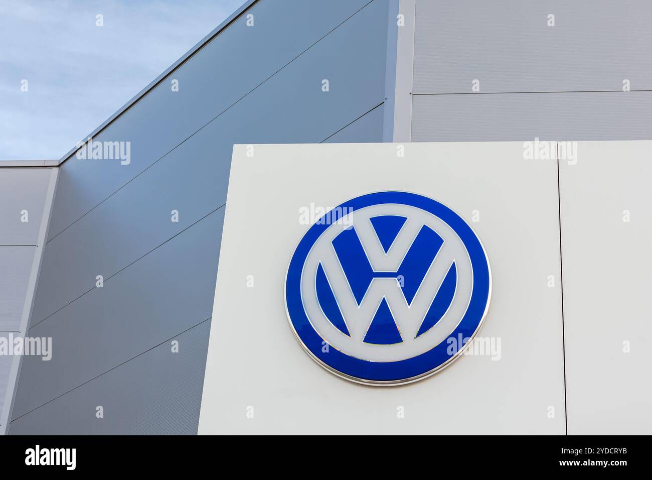 Volkswagen brand logo on blue sky background Stock Photo - Alamy