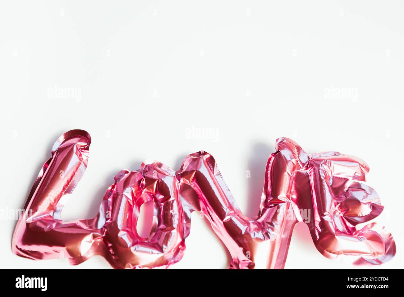 Love concept. Inflatable pink balloon with letters Stock Photo - Alamy