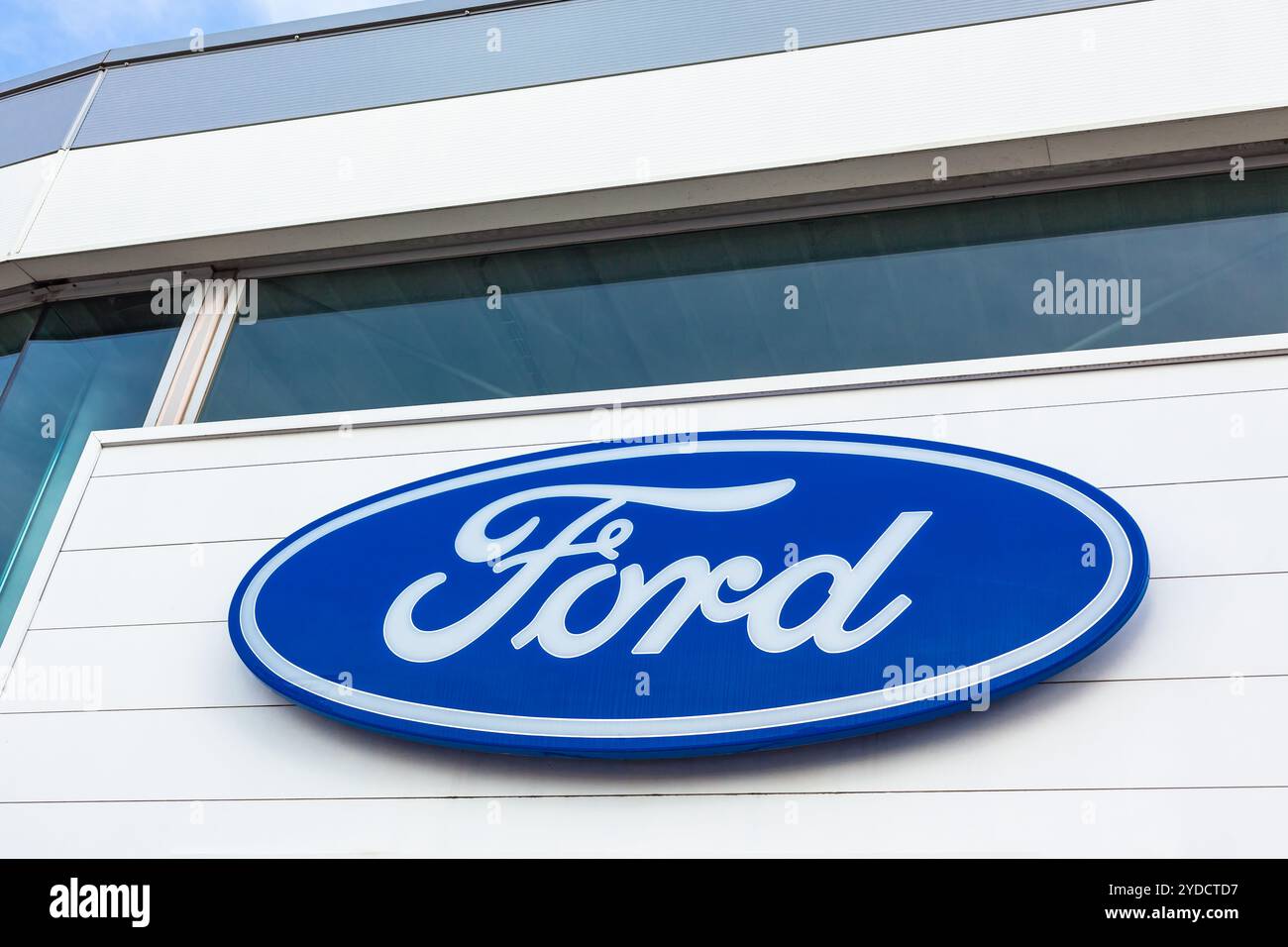 Ford Motor Company brand logo on bright blue sky background located on ...