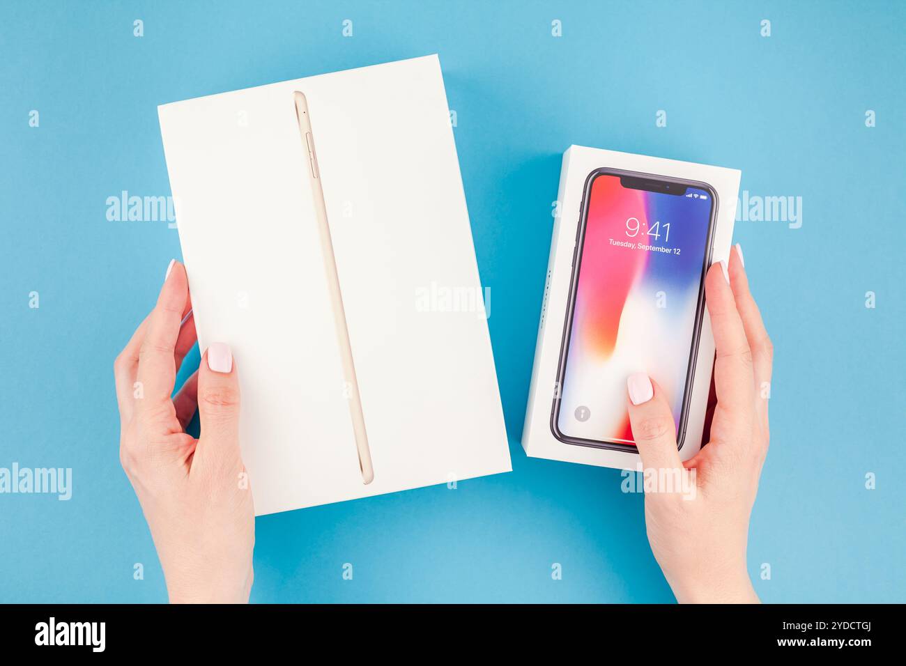 Woman hands with the box of Apple devices Stock Photo - Alamy