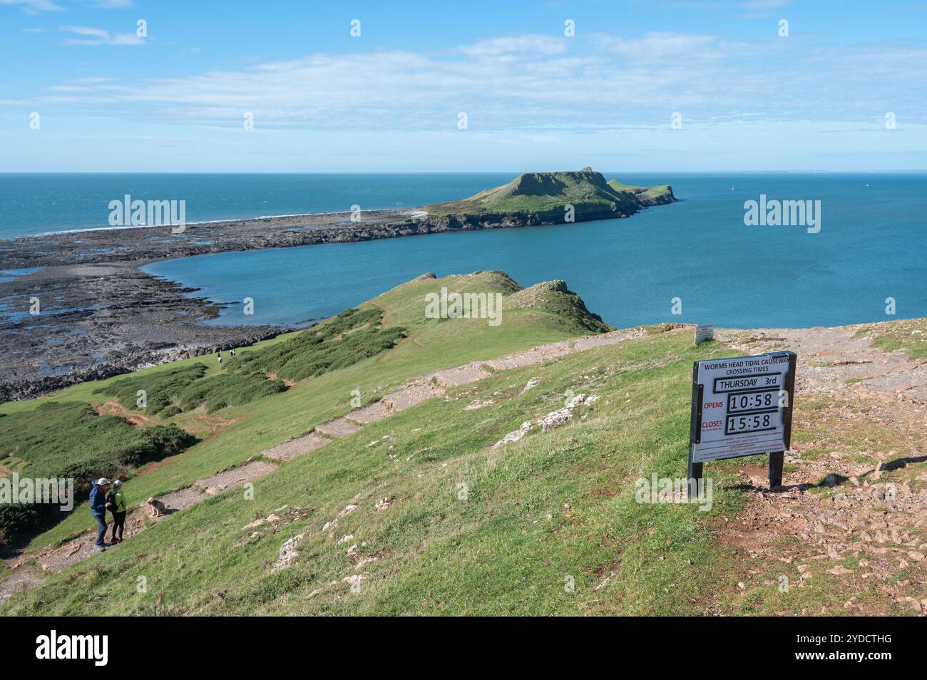 Causeway sign and Worms Head, Rhossili, Gower, Wales, UK Stock Photo ...