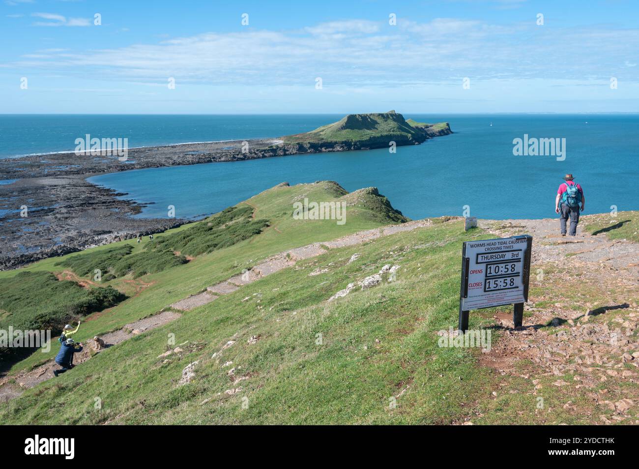 Causeway sign and Worms Head, Rhossili, Gower, Wales, UK Stock Photo ...