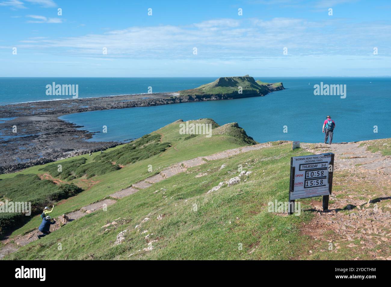 Causeway sign and Worms Head, Rhossili, Gower, Wales, UK Stock Photo ...