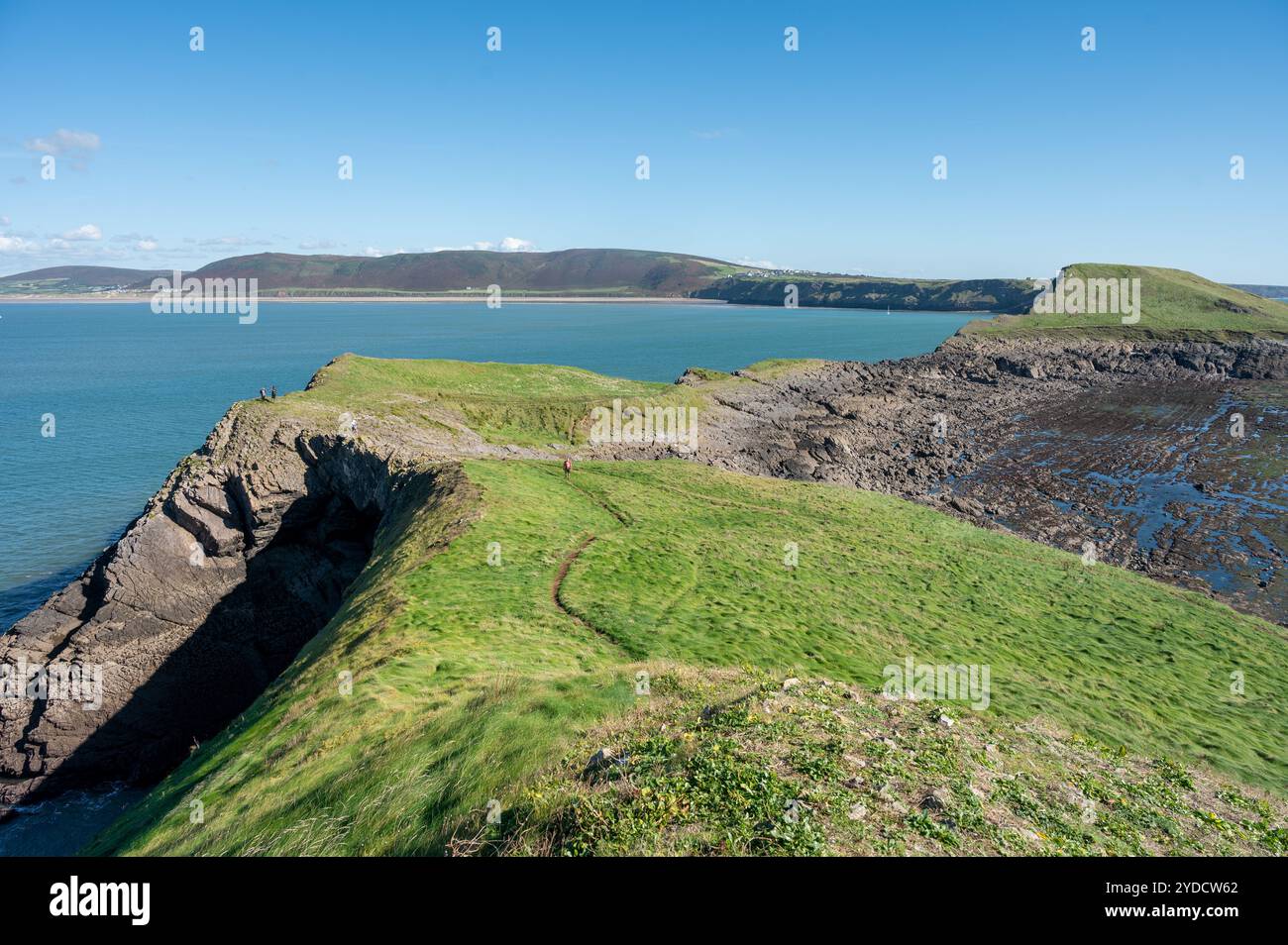 View along Worms Head to the mainland from the Outer Head, Gower, Wales ...
