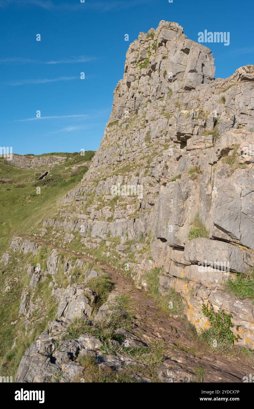 Exposed footpath under limestone cliff, Fall Bay, Gower, Wales, UK ...