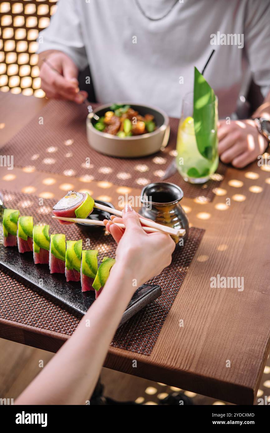 Japanese girl eating sushi hi-res stock photography and images - Alamy