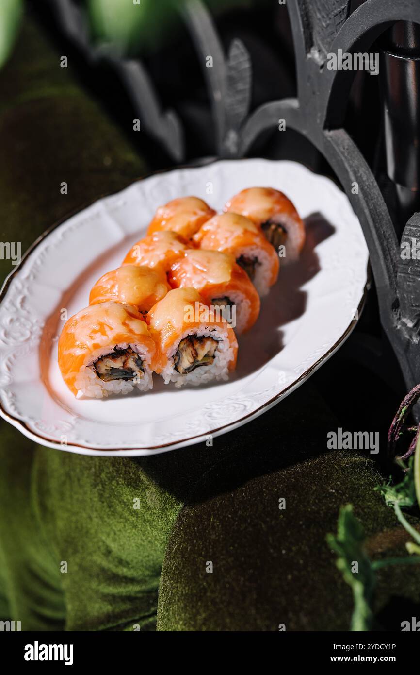 Salmon Fried sushi roll with eel and cheese Stock Photo - Alamy