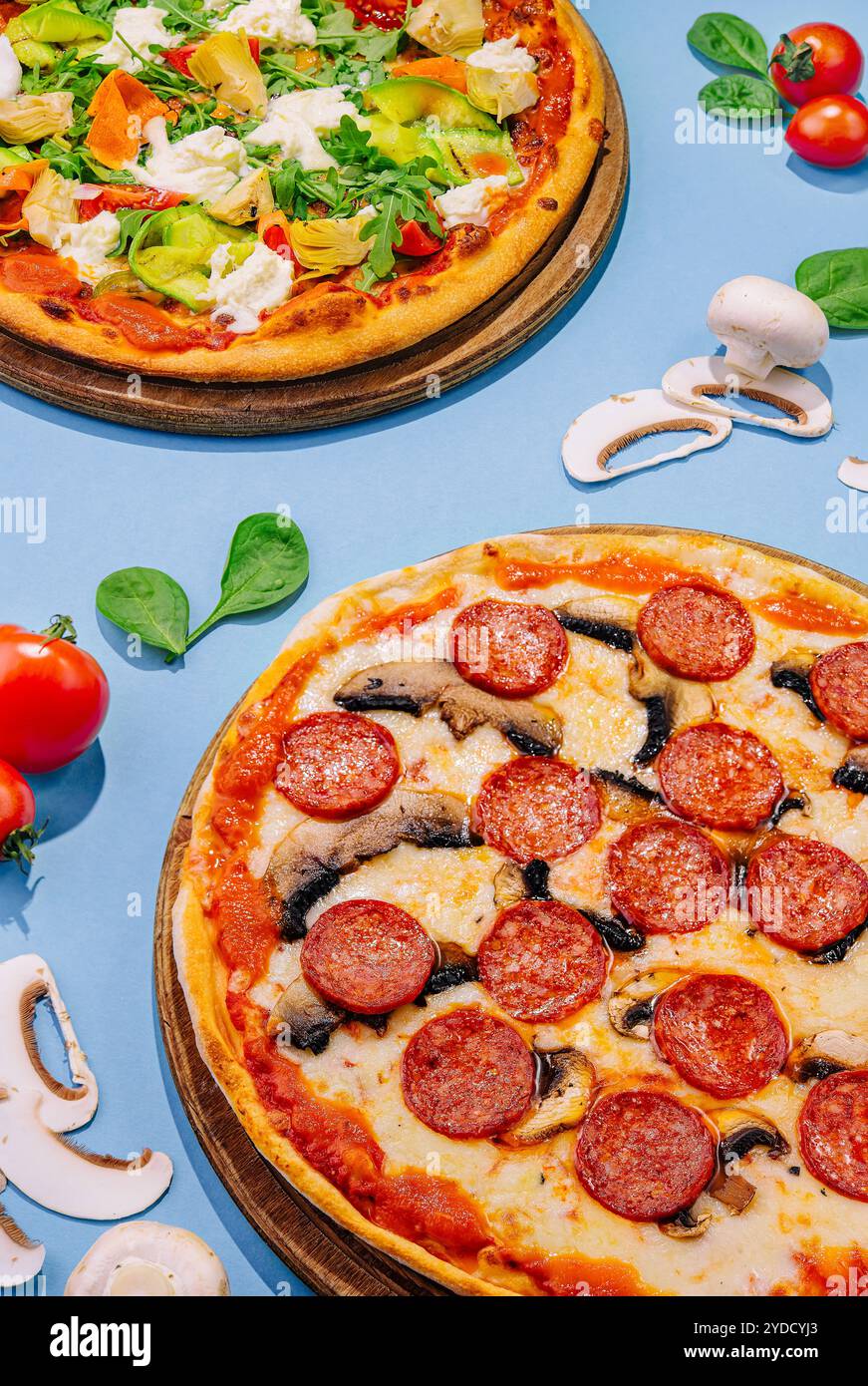 Fresh tasty pizzas on top view Stock Photo - Alamy