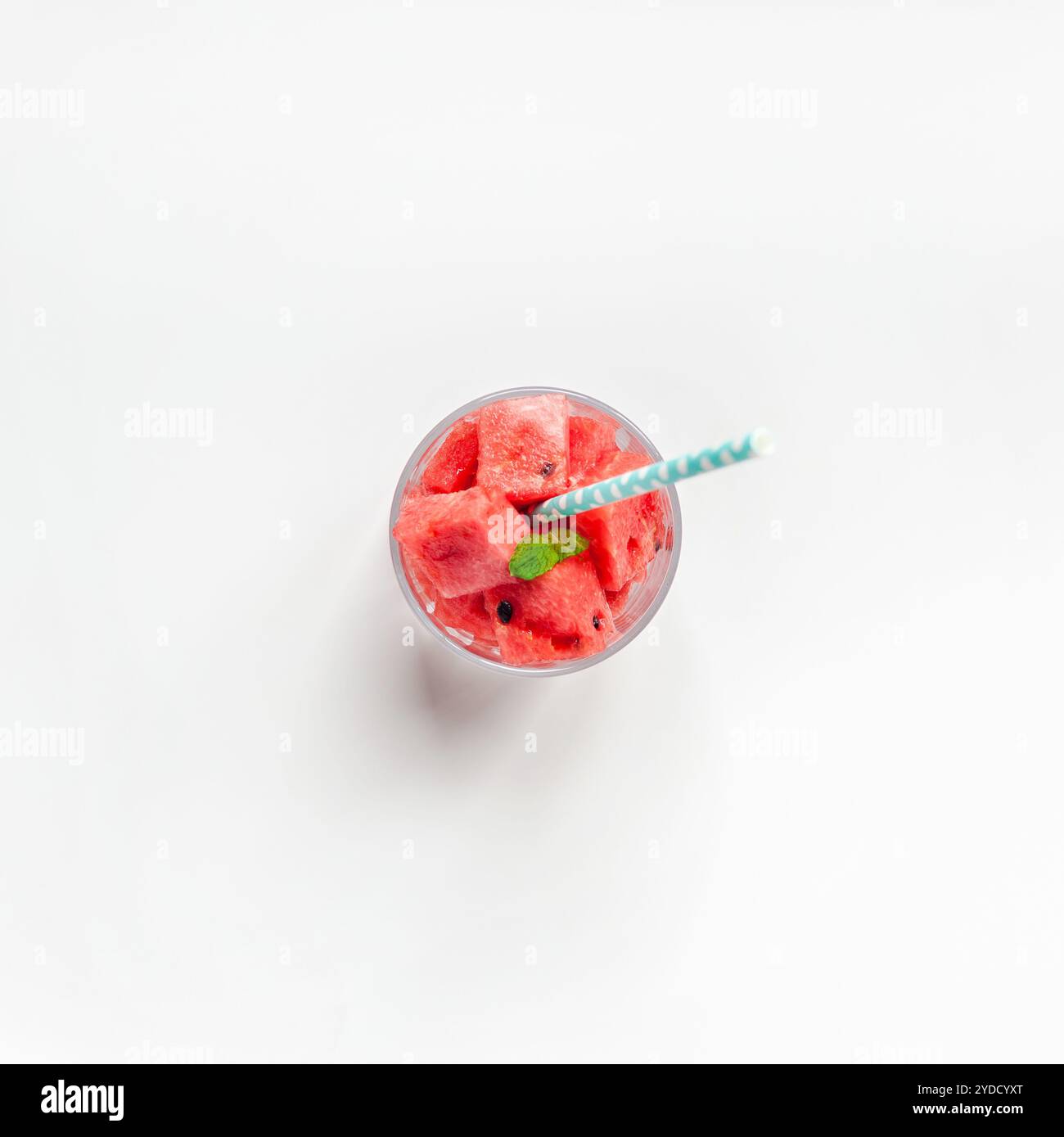 Crushed watermelon in glass on white background Stock Photo - Alamy