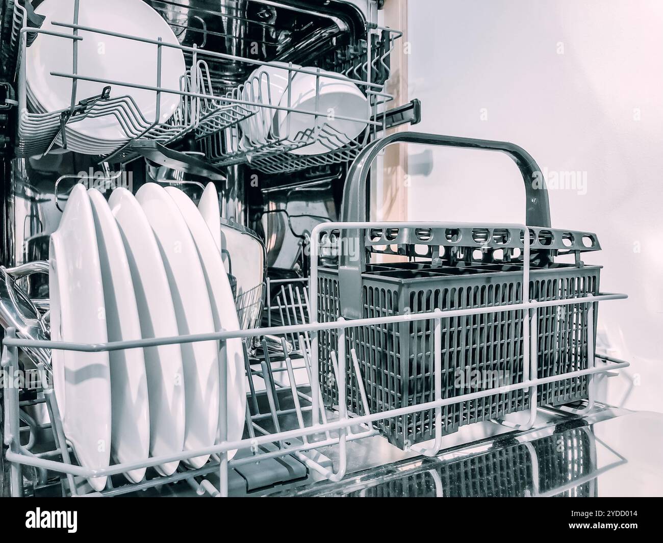 Open dishwasher machine with white clean dishes Stock Photo - Alamy