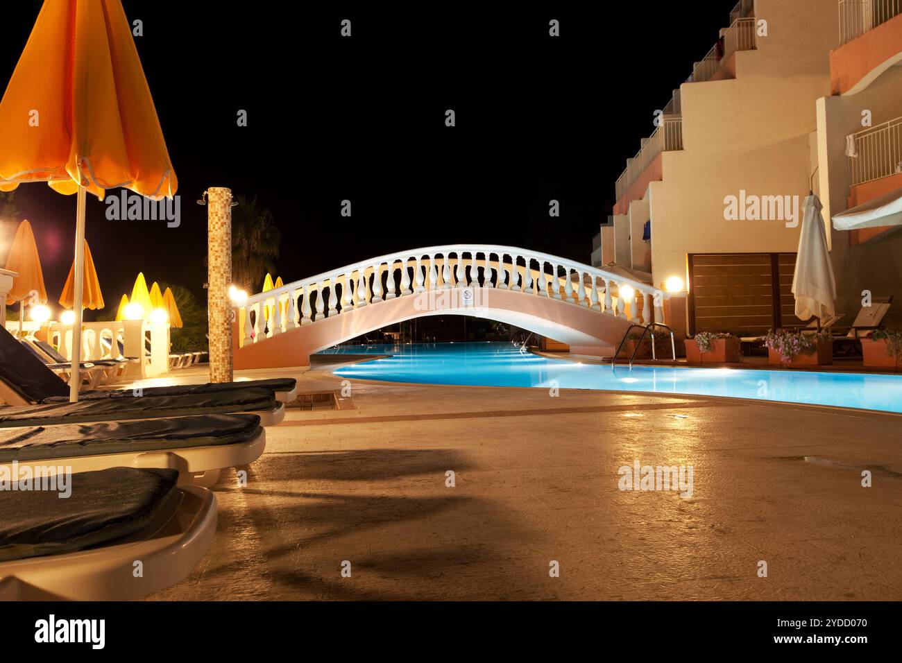 Pool of Greek hotel at night Stock Photo - Alamy