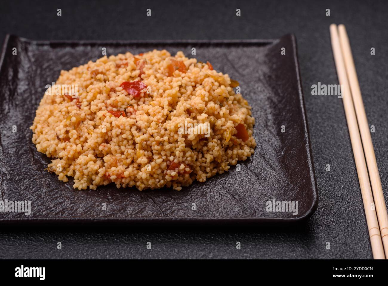 Delicious hot boiled wheat porridge couscous with vegetables Stock ...