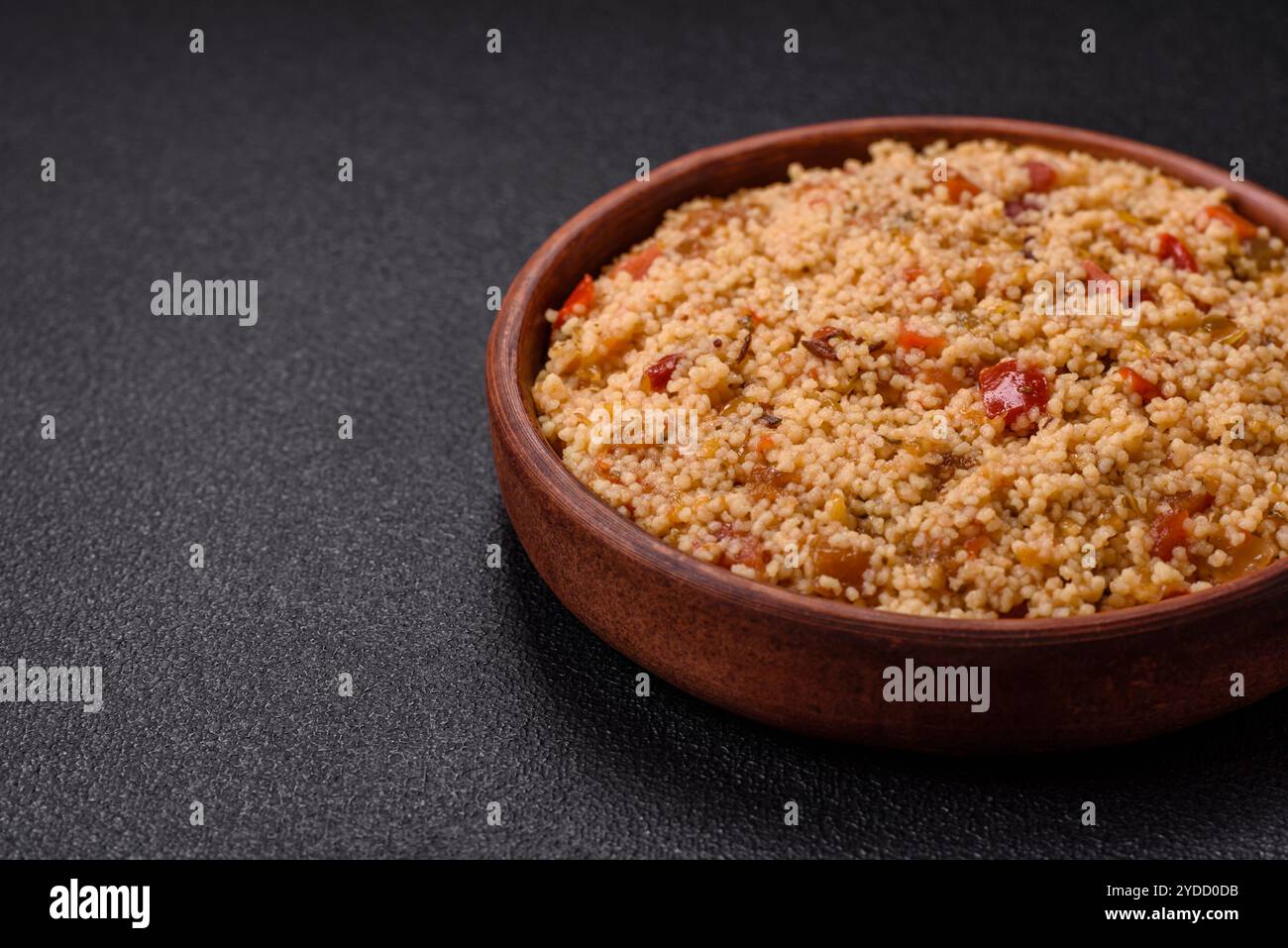 Delicious hot boiled wheat porridge couscous with vegetables Stock ...