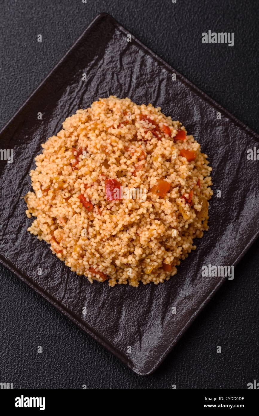 Delicious hot boiled wheat porridge couscous with vegetables Stock ...