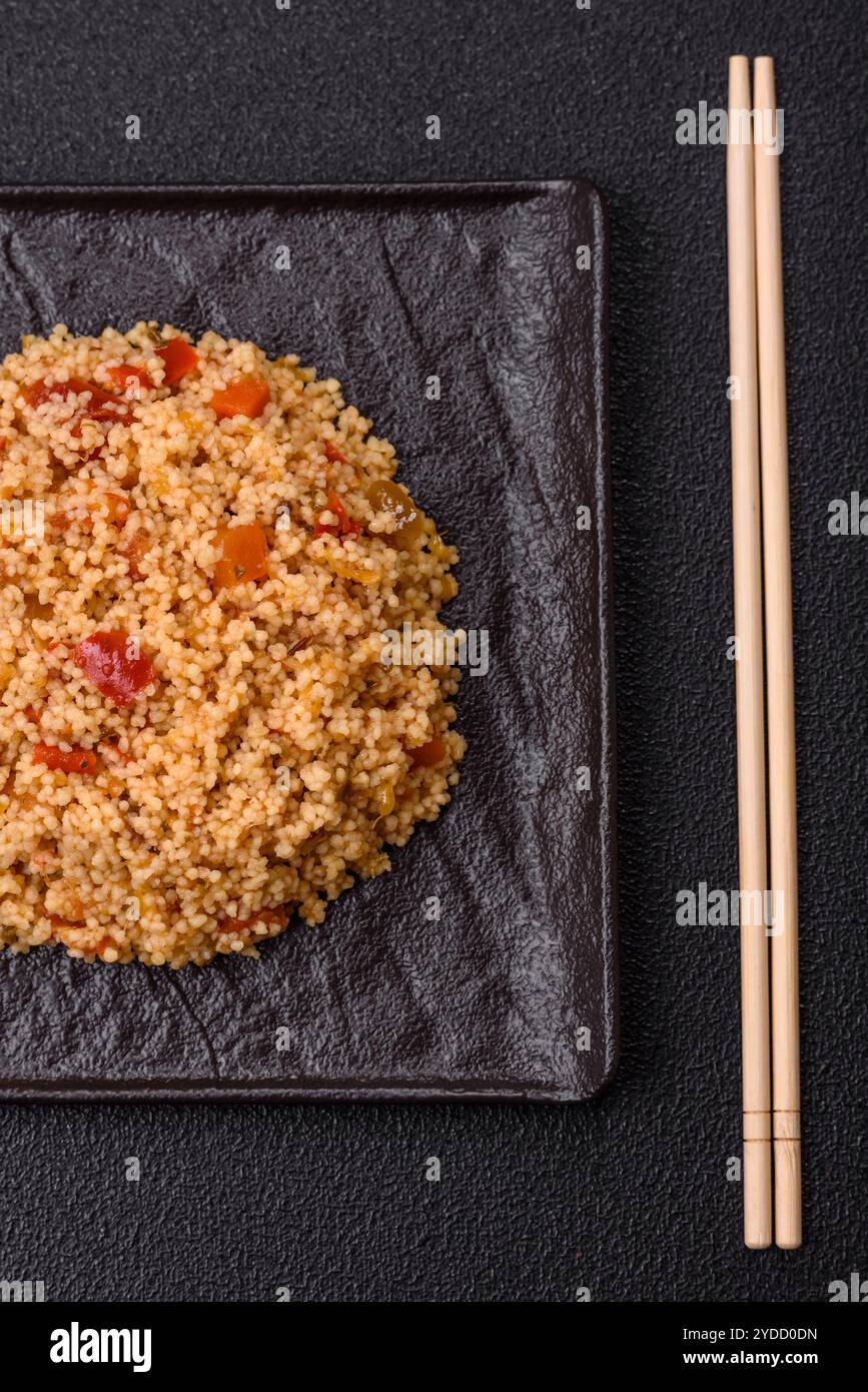 Delicious hot boiled wheat porridge couscous with vegetables Stock ...