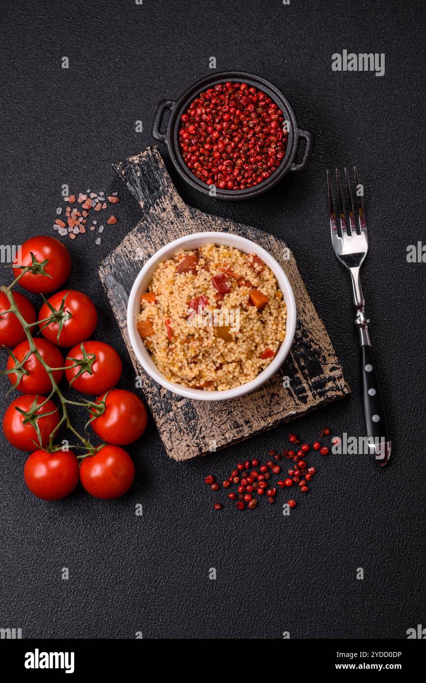 Delicious hot boiled wheat porridge couscous with vegetables Stock ...