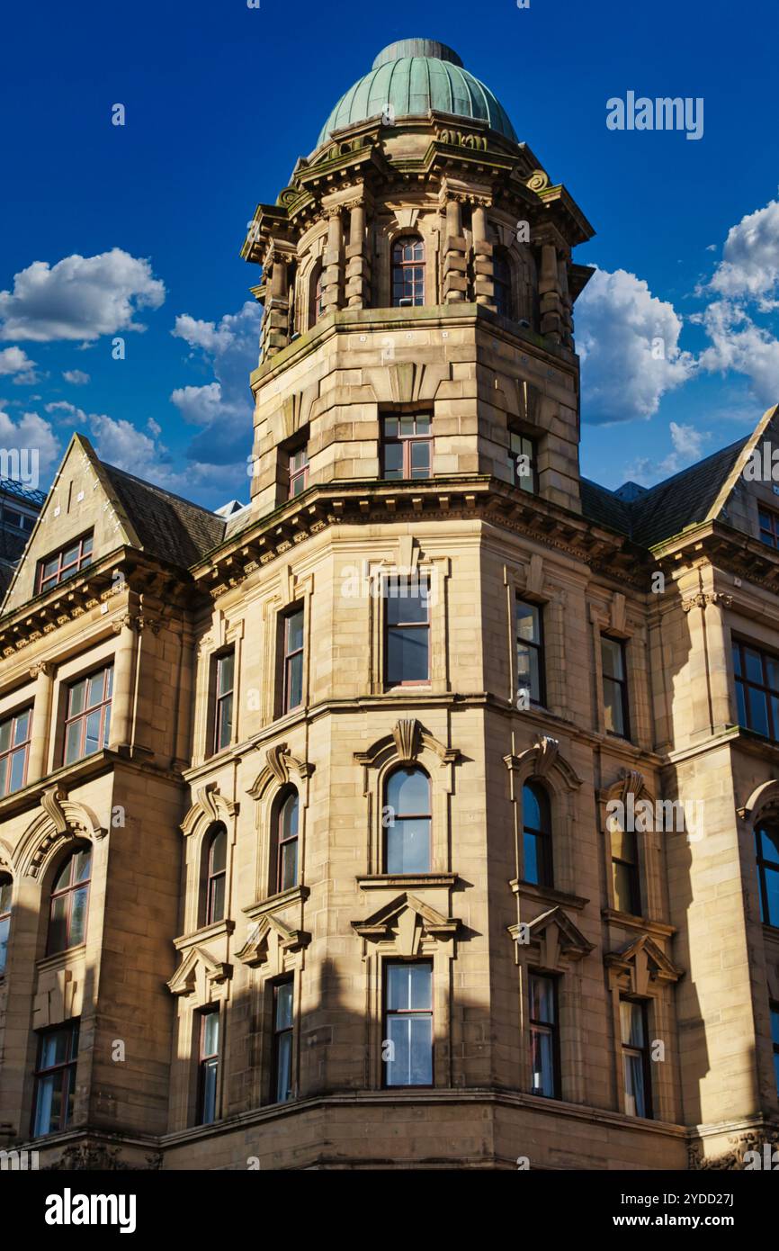 A tall, ornate building with a domed roof and numerous windows. The ...