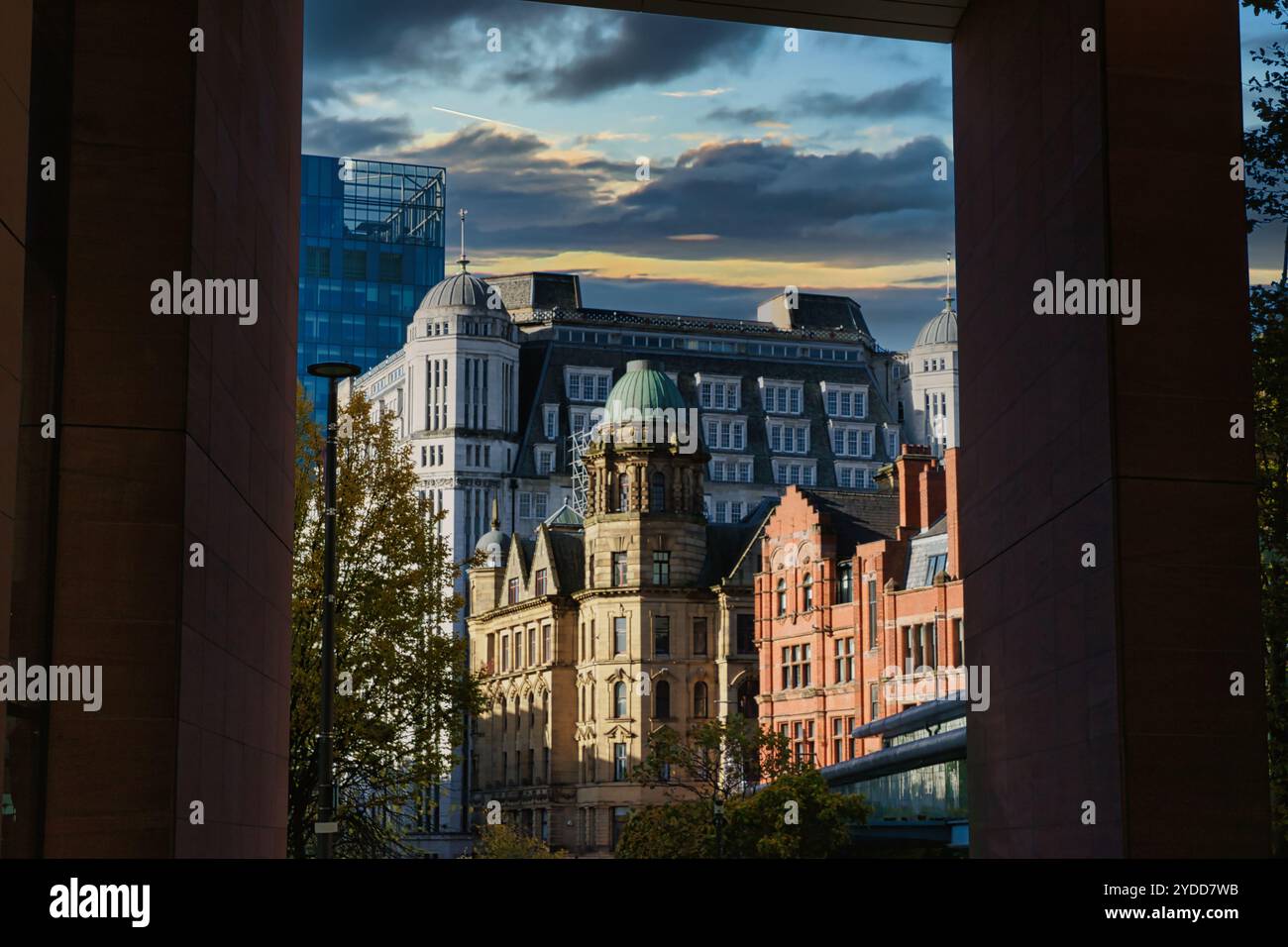 A view of city buildings through a doorway or opening in another ...