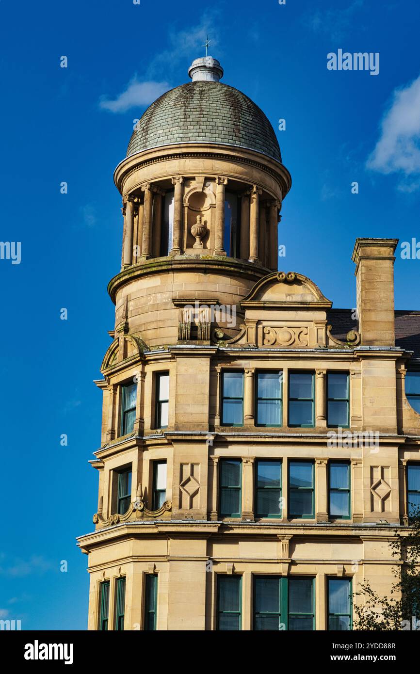 A close-up shot of a building with a domed roof and multiple windows ...