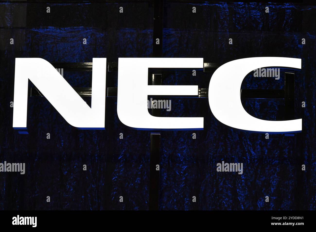 NEC Co.'s logo is displayed at its booth during the Japan International ...