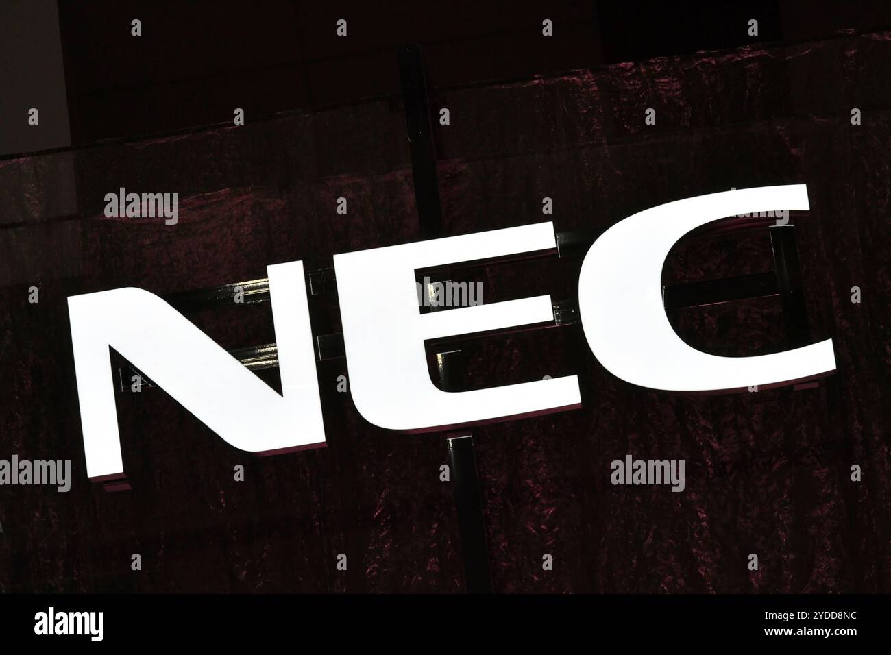 NEC Co.'s logo is displayed at its booth during the Japan International ...