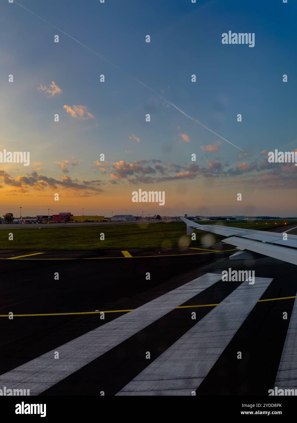 Airplane View of the Runway During Sunset at the Airport, Capturing the ...