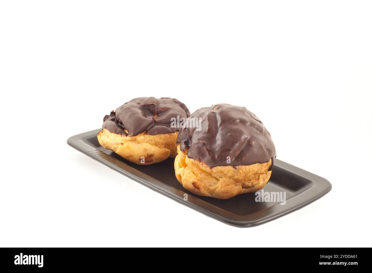 Chocolate coated fresh cream puffs Stock Photo - Alamy