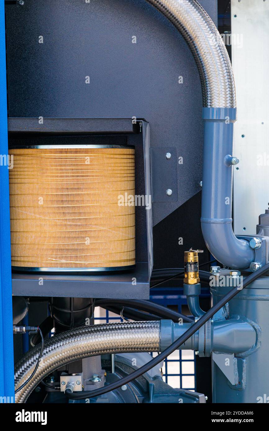 Replacing air filter cartridge in industrial compressor unit during ...