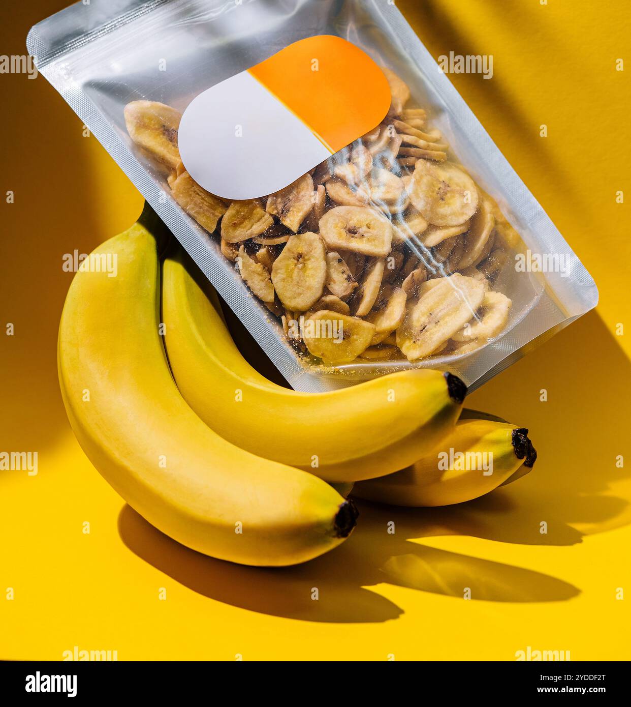 Pack of dried bio organic healthy banana chips Stock Photo - Alamy