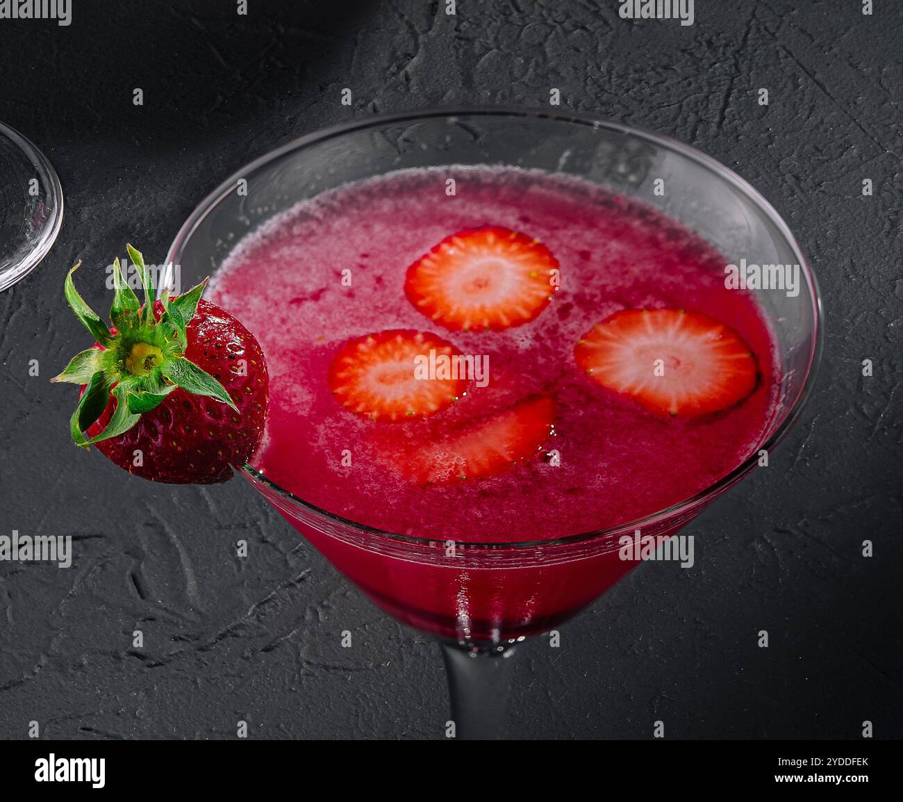 Martini glass of red alcohol drink Stock Photo - Alamy