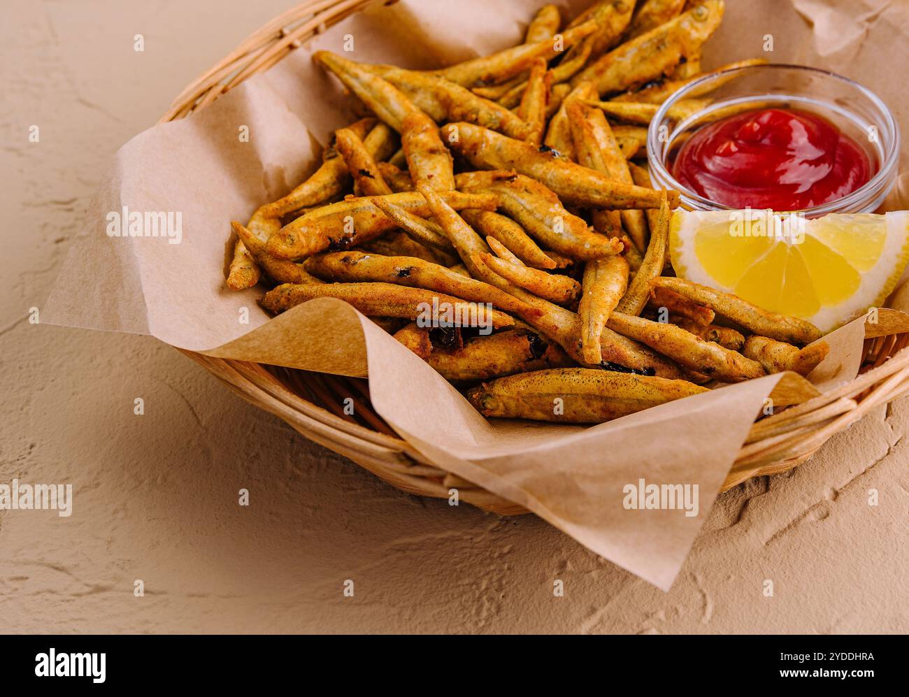 fried fish with lemon and ketchup Stock Photo - Alamy