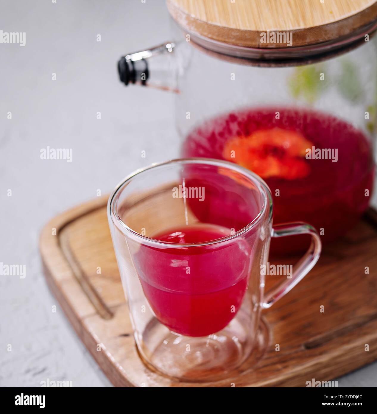 Raspberry Tea in Pitcher and Glass Stock Photo - Alamy