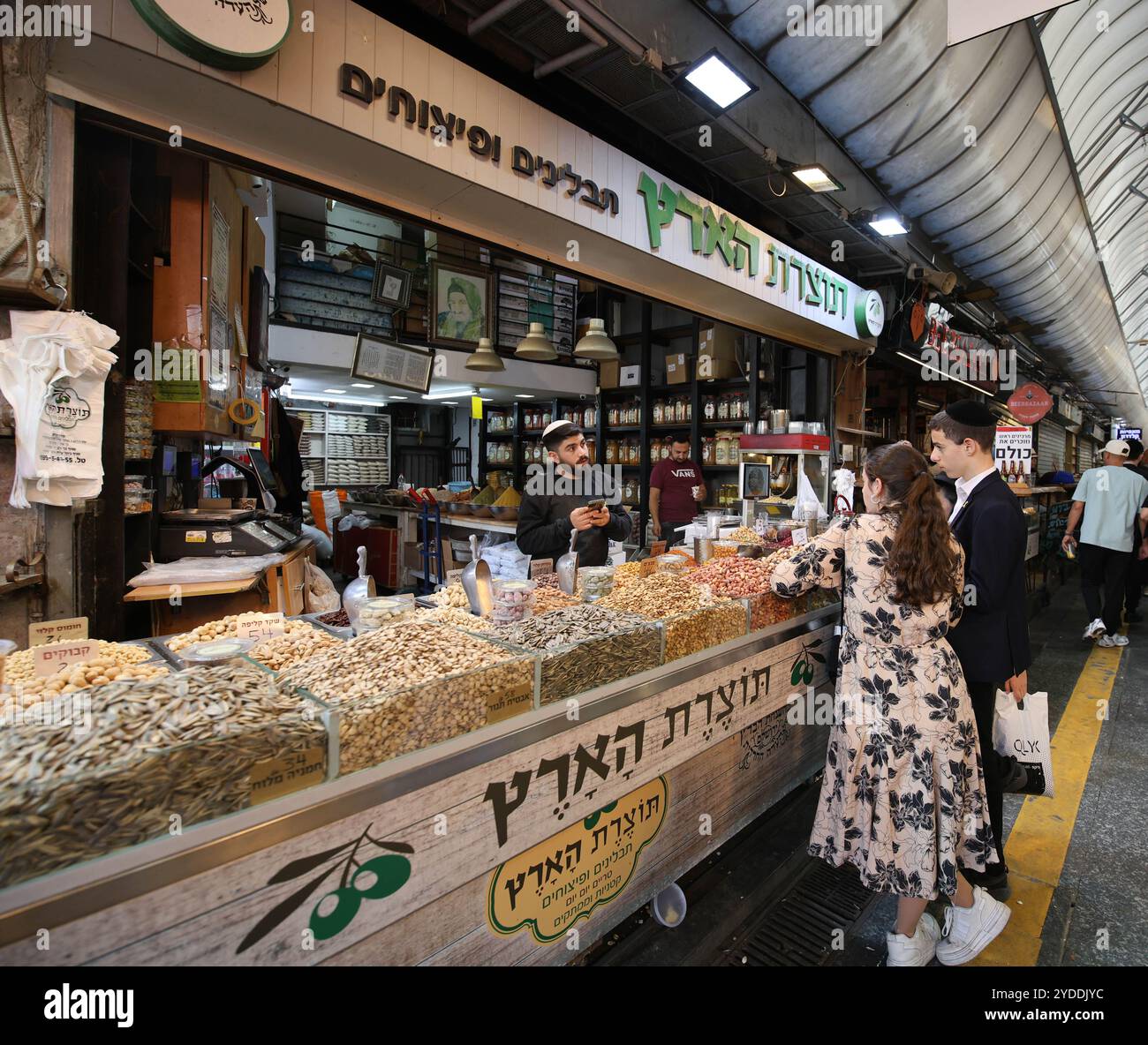 People shop at Machane Yehuda Market in Jerusalem, Israel, on Oct. 20 ...