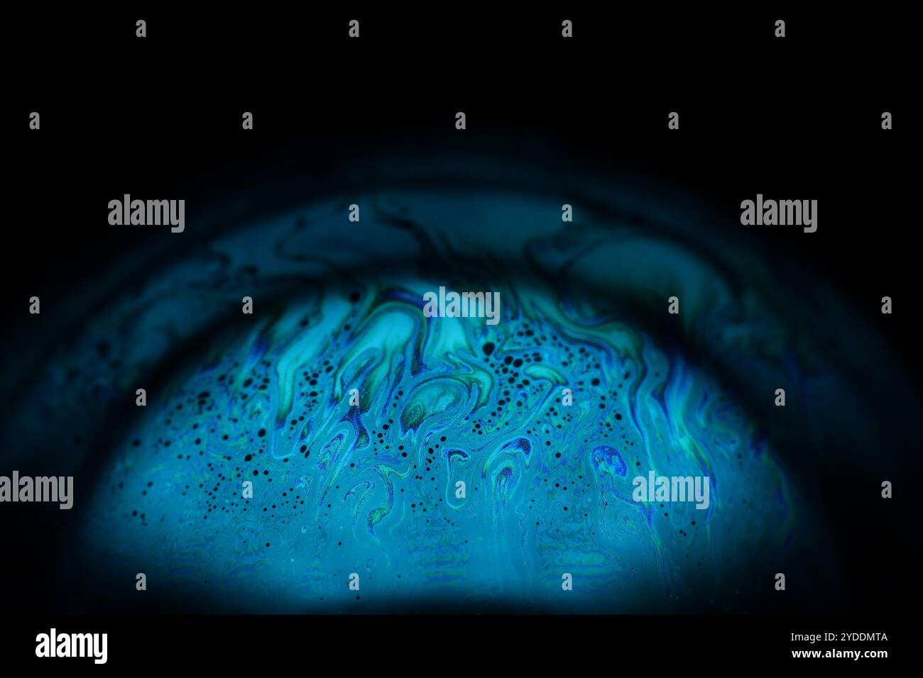 Bright blue liquid on black background, oil stains movement, bright ...