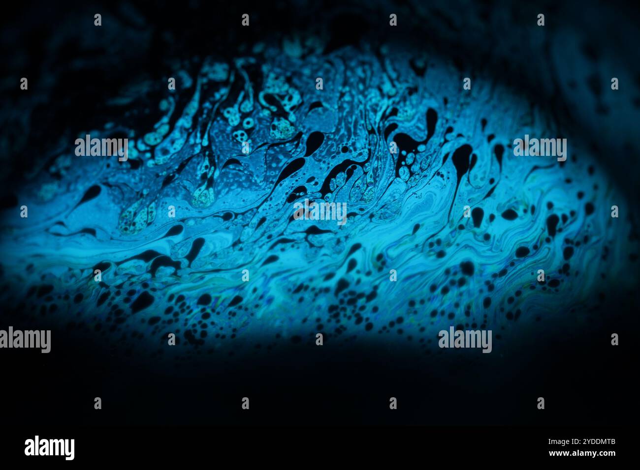 Bright blue dots on black background, oil stains movement, bright ...