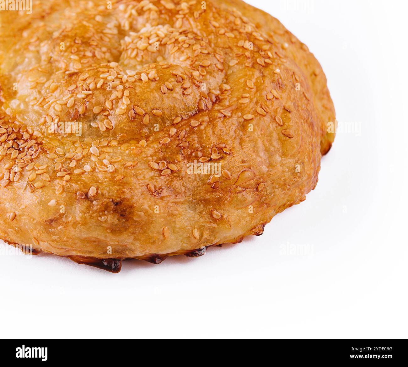 Puff pastry bun rolled up in the form of a snail Stock Photo - Alamy