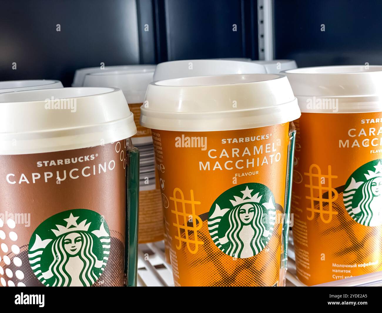 Starbucks coffee cups row ready to go Stock Photo - Alamy
