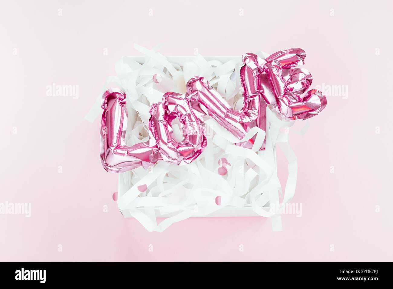 Love concept. Inflatable pink balloon with letters Stock Photo - Alamy
