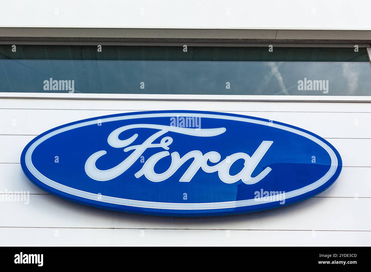 Ford brand logo on bright blue sky background Stock Photo - Alamy
