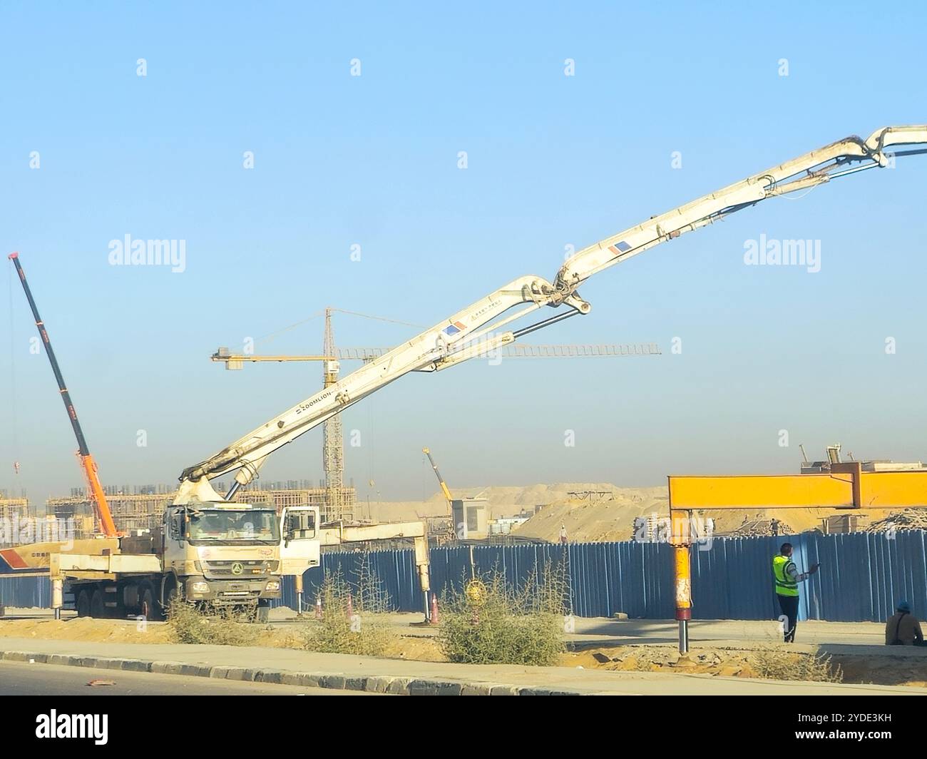 Concrete boom pump pouring concrete hi-res stock photography and images ...