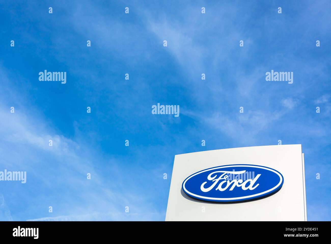 Ford brand logo on bright blue sky background Stock Photo - Alamy