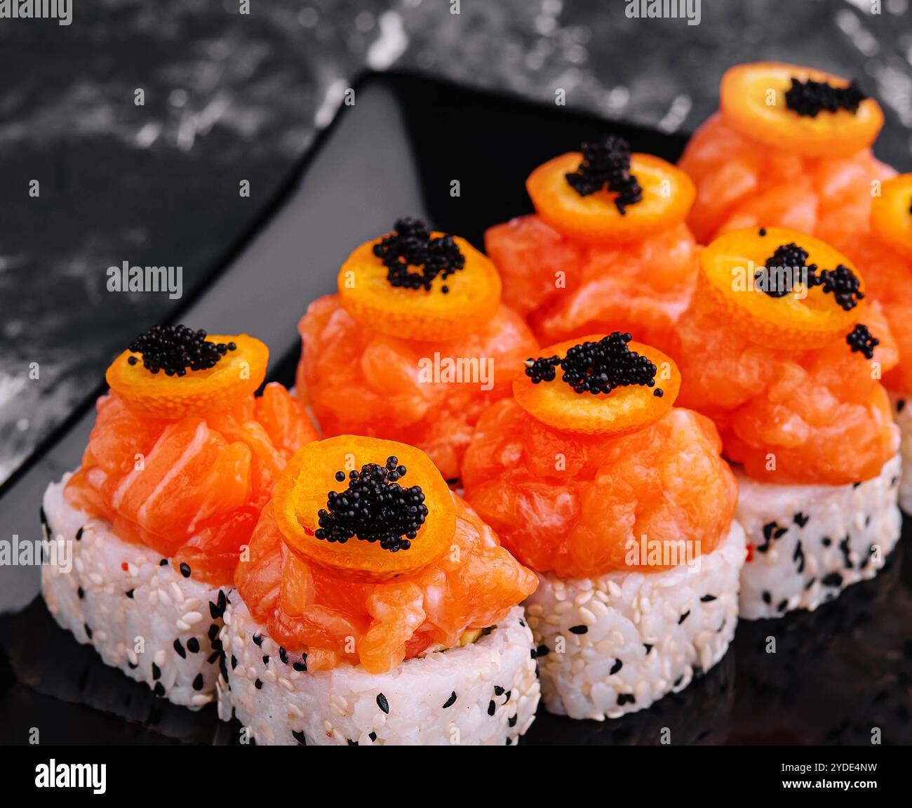 Maki Sushi - Roll topped with Sliced Spicy Salmon Stock Photo - Alamy